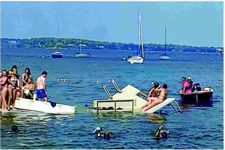 DOZENS DUMPED INTO WATER AS PIER COLLAPSES