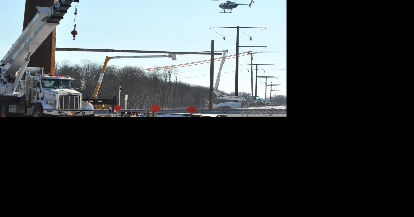 Helicopter helps string power lines through the Dells