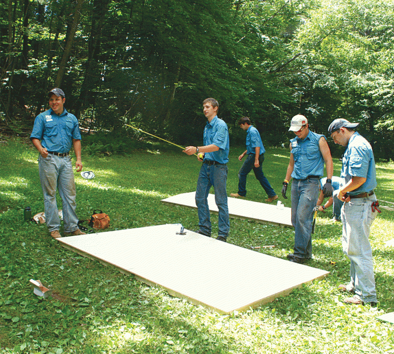 College fraternity constructs sheds at Camp Wawbeek