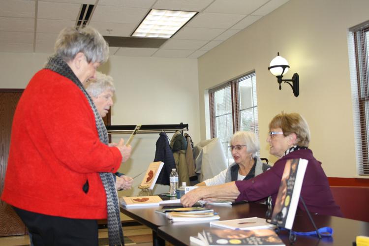 Reedsburg author releases third book, tells life story through work