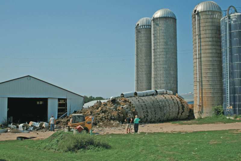 Neighbors assist in clean up of fallen silo