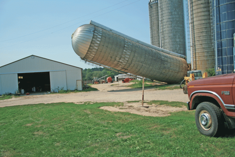 Neighbors assist in clean up of fallen silo