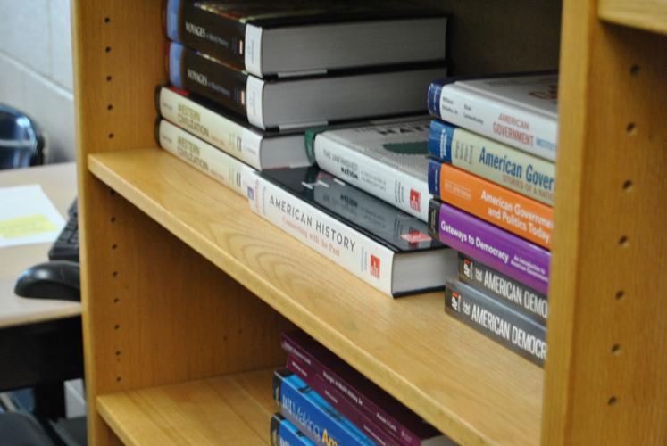 College students prepare for spring semester by weighing textbook ...