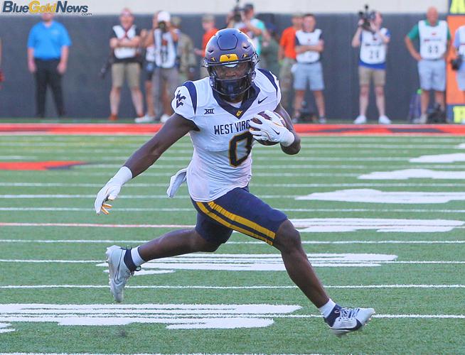 West Virginia steamrolls Oklahoma State, 38-14, behind impressive ...