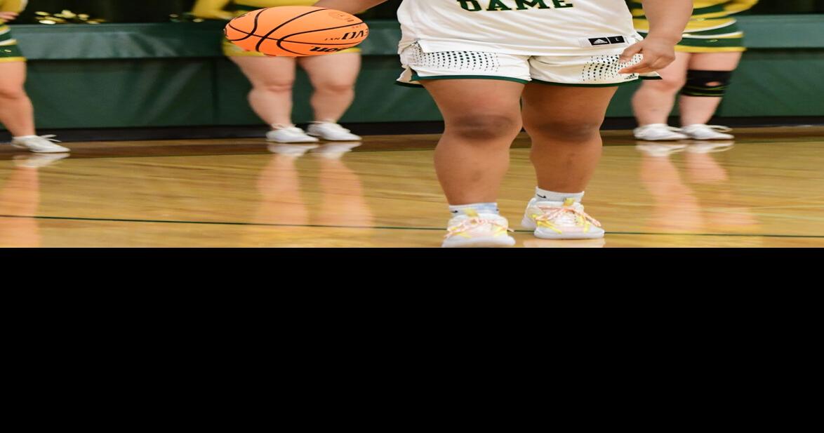 Selena Wilson brings the ball upcourt after a defensive rebound.JPG ...