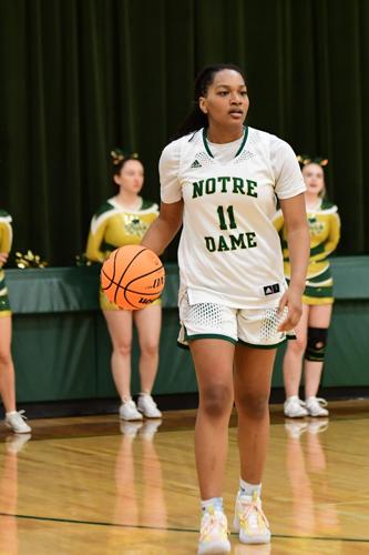 Selena Wilson brings the ball upcourt after a defensive rebound.JPG ...