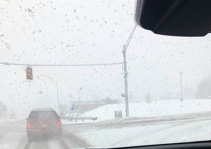 Snow closes roads in Morgantown (West Virginia), city plows working through the day to treat icy ...