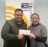 Brad Riffee gives check | | wvnews.com