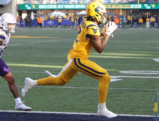 West Virginia leads Albany, 28-14, at half time behind Garrett Greene's ...