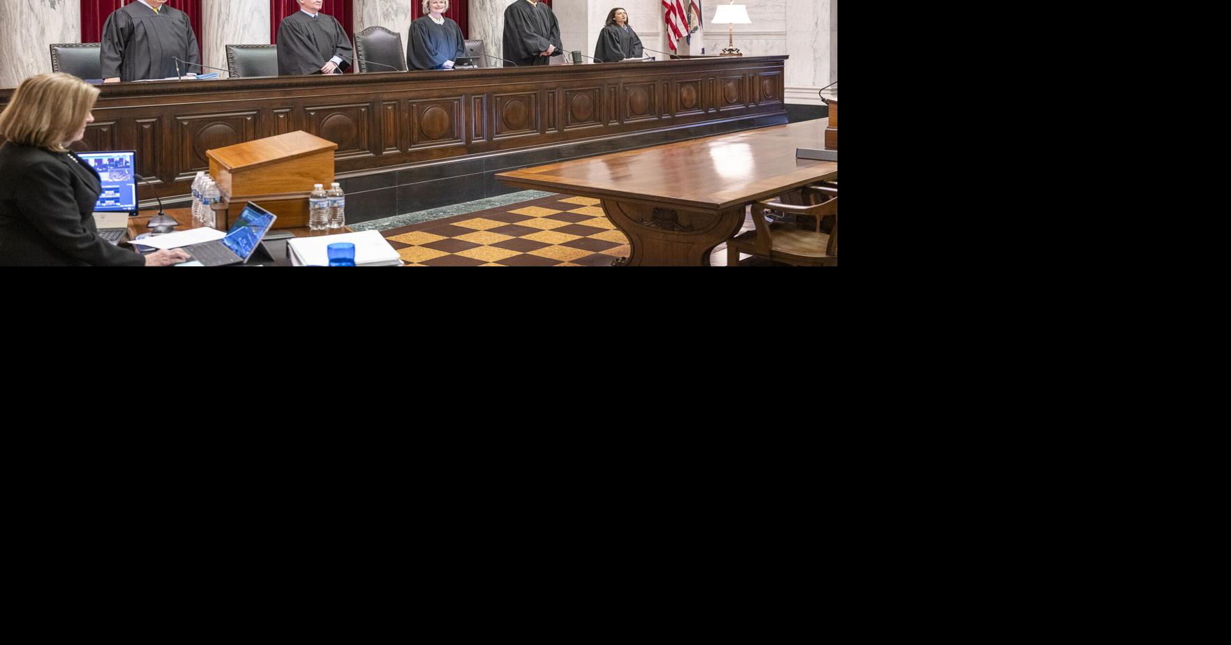 In the background: Several lawyers help West Virginia justices as they ...