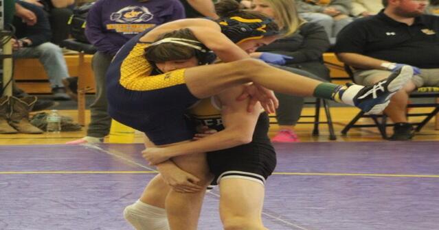 Keyser's Owen Rotruck is shown lifting his opponent into the air ...