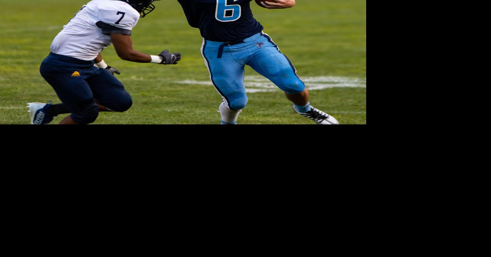 Frankfort quarterback Luke Robinette is shown stiff-arming his ...