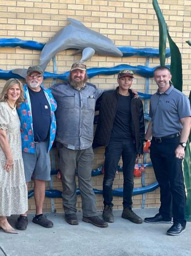 Original artist restores 'Aquatic Jungle' sculpture at Ripley ...