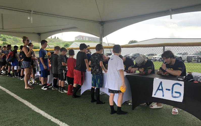 West Virginia University football players participate in Diversified ...