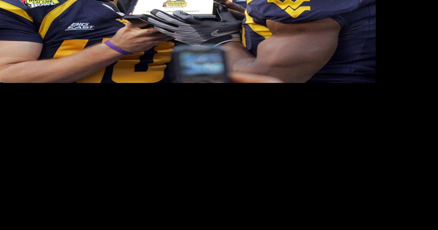 Meineke Car Care Bowl 2008 Pat McAfee and Dorrell Jalloh kiss trophy ...