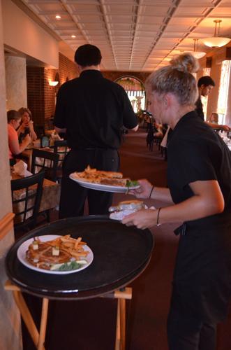 Ashley Bright gets into the groove of serving at her first job ...