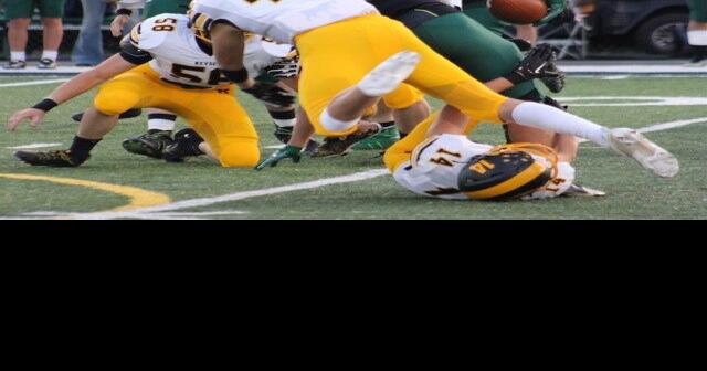 Keyser sophomores Owen Rotruck (14) and Grayson Lambka (41) tackle the ...