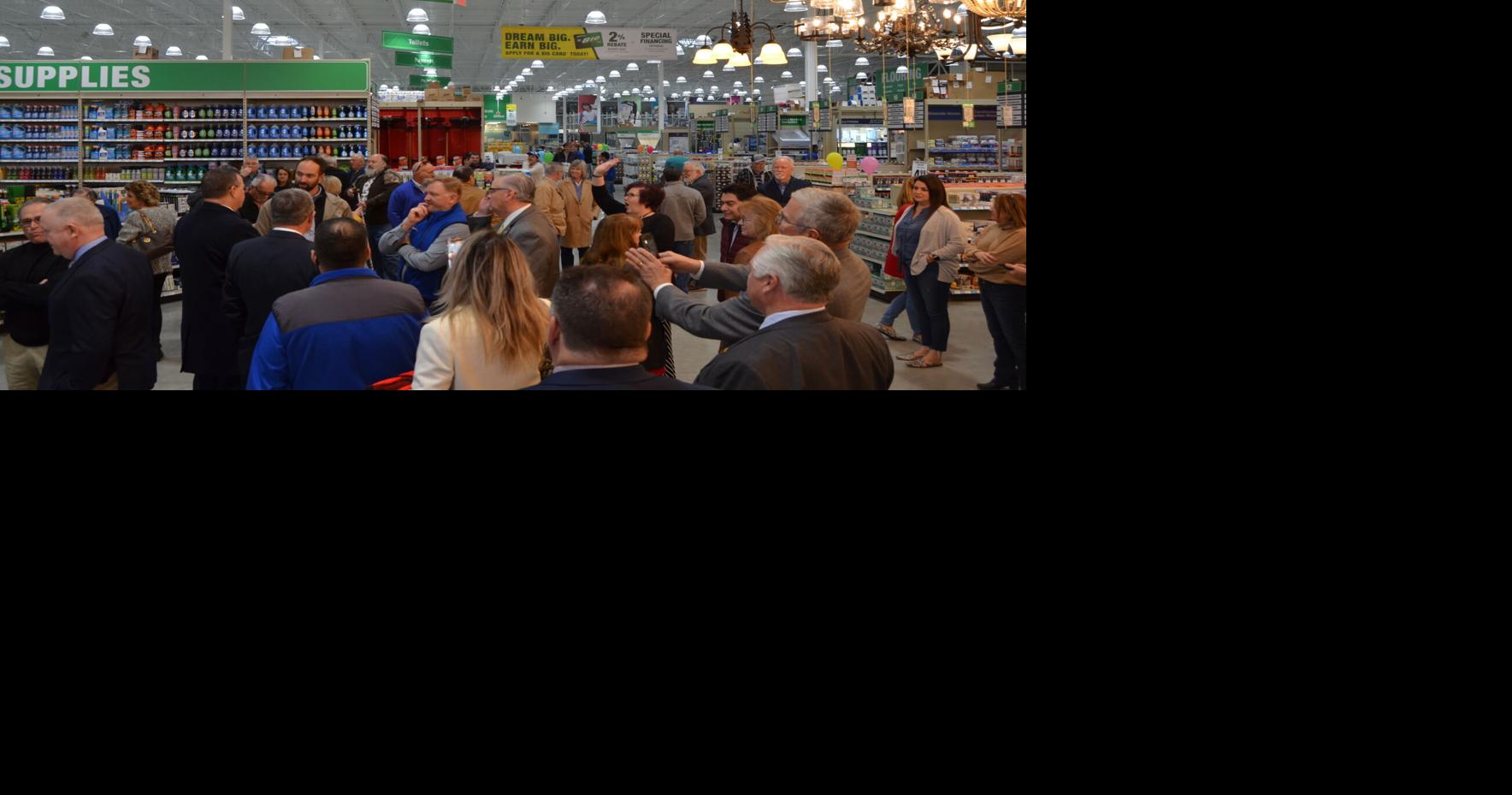 Menards staff and local officials inside Menards prior to board cutting ...