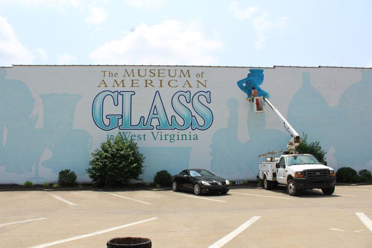 Artist adding mural on Main Street in Weston | WV News | wvnews.com
