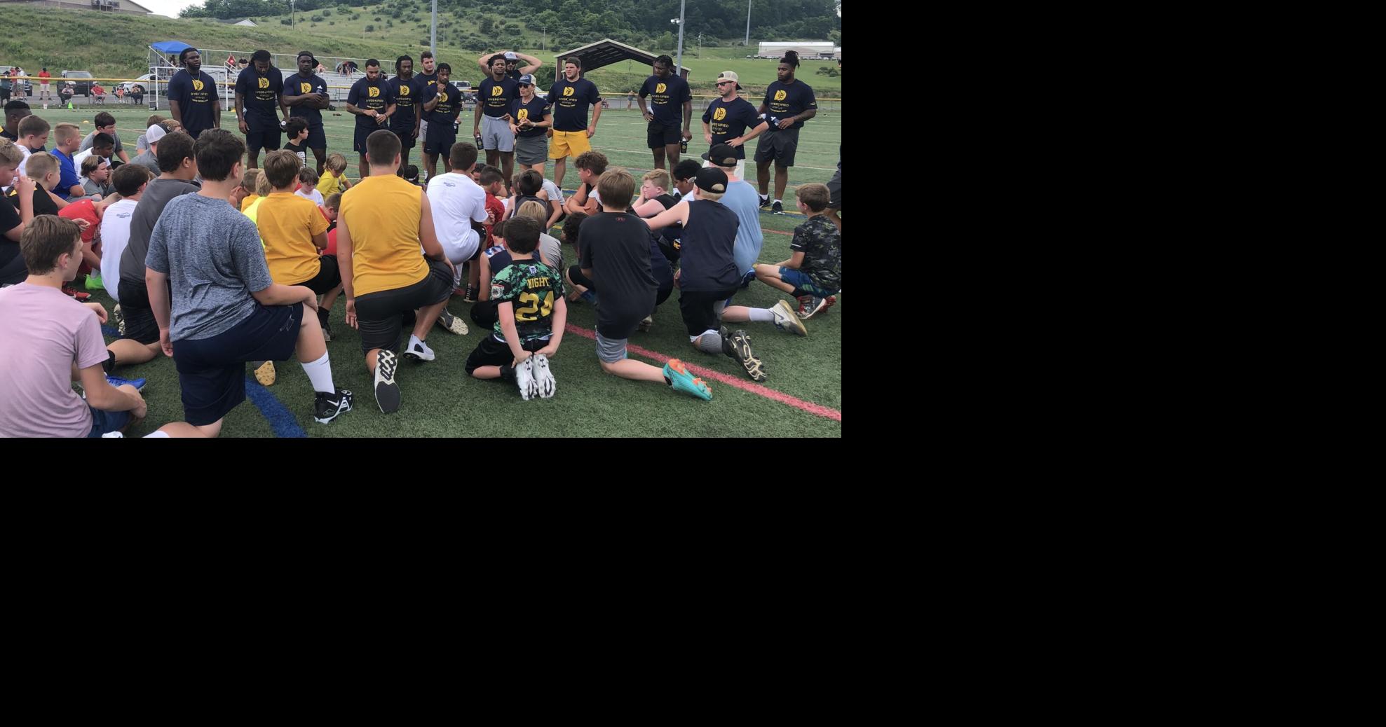 West Virginia University football players participate in Diversified ...