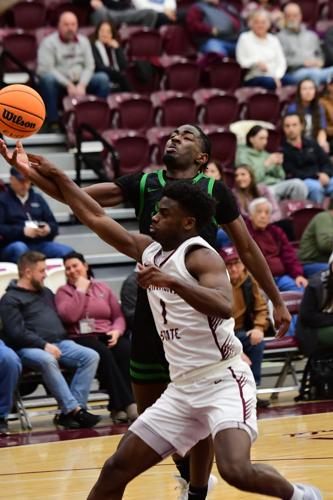 Zyon Dobbs catches up with Khemanni Davis at the rim.JPG | | wvnews.com