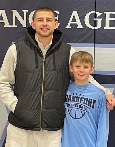 Erik Stevenson poses with Asher Miller on Sunday, | | wvnews.com