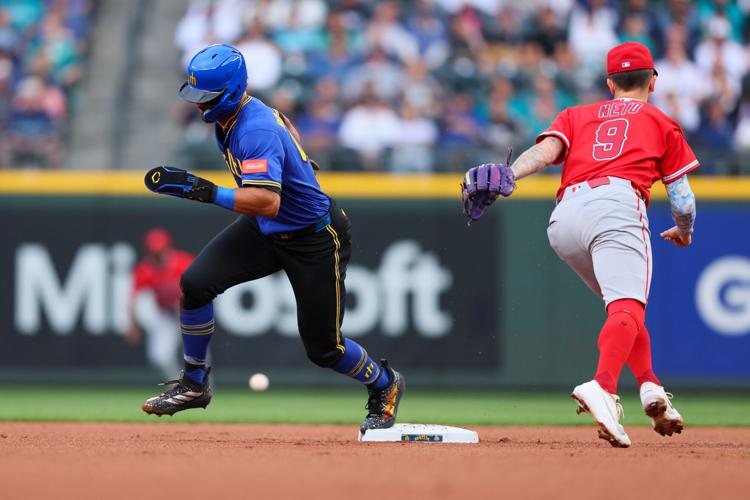 Mariners' Rodriguez removed after being hit in helmet by thrown ball ...