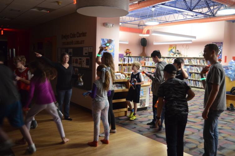 Glow-in-the-dark laser gun battle at Bridgeport library promotes ...