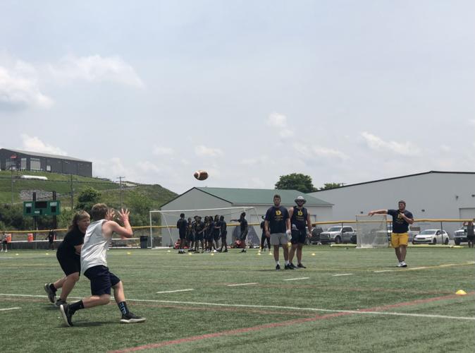 West Virginia University football players participate in Diversified ...