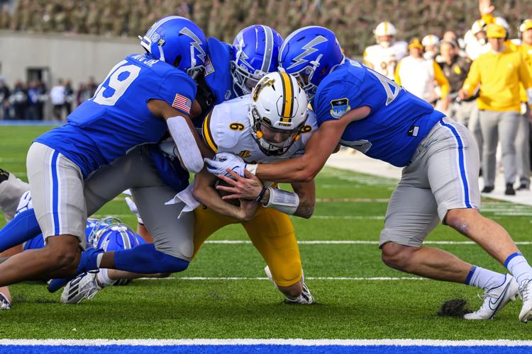 UW quarterback Andrew Peasley embraces fatherhood in final season ...