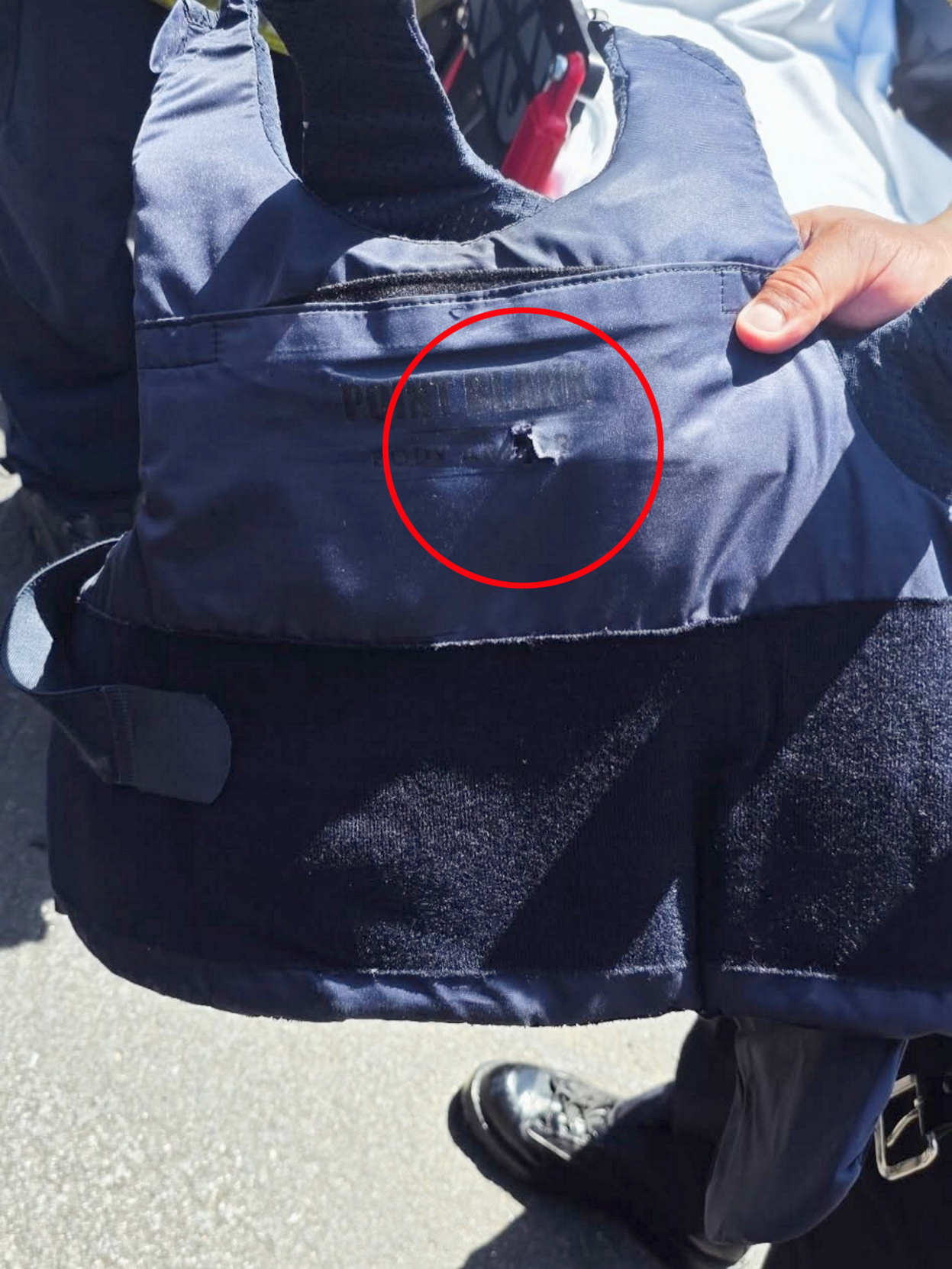 Cop shot in chest during gun battle saved by bulletproof vest ...