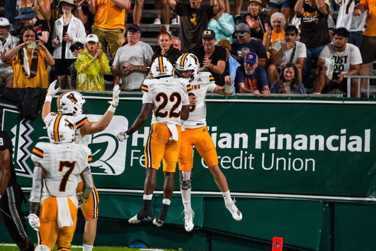 Cowboys hold off Hawaii 27-20 in Honolulu to reclaim Paniolo Trophy ...