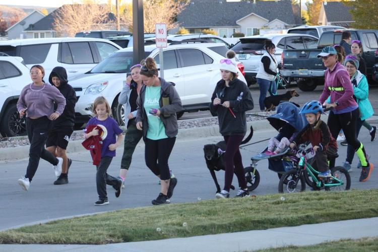 End the Silence: Community gathers for YWCA's inaugural purple glow run ...