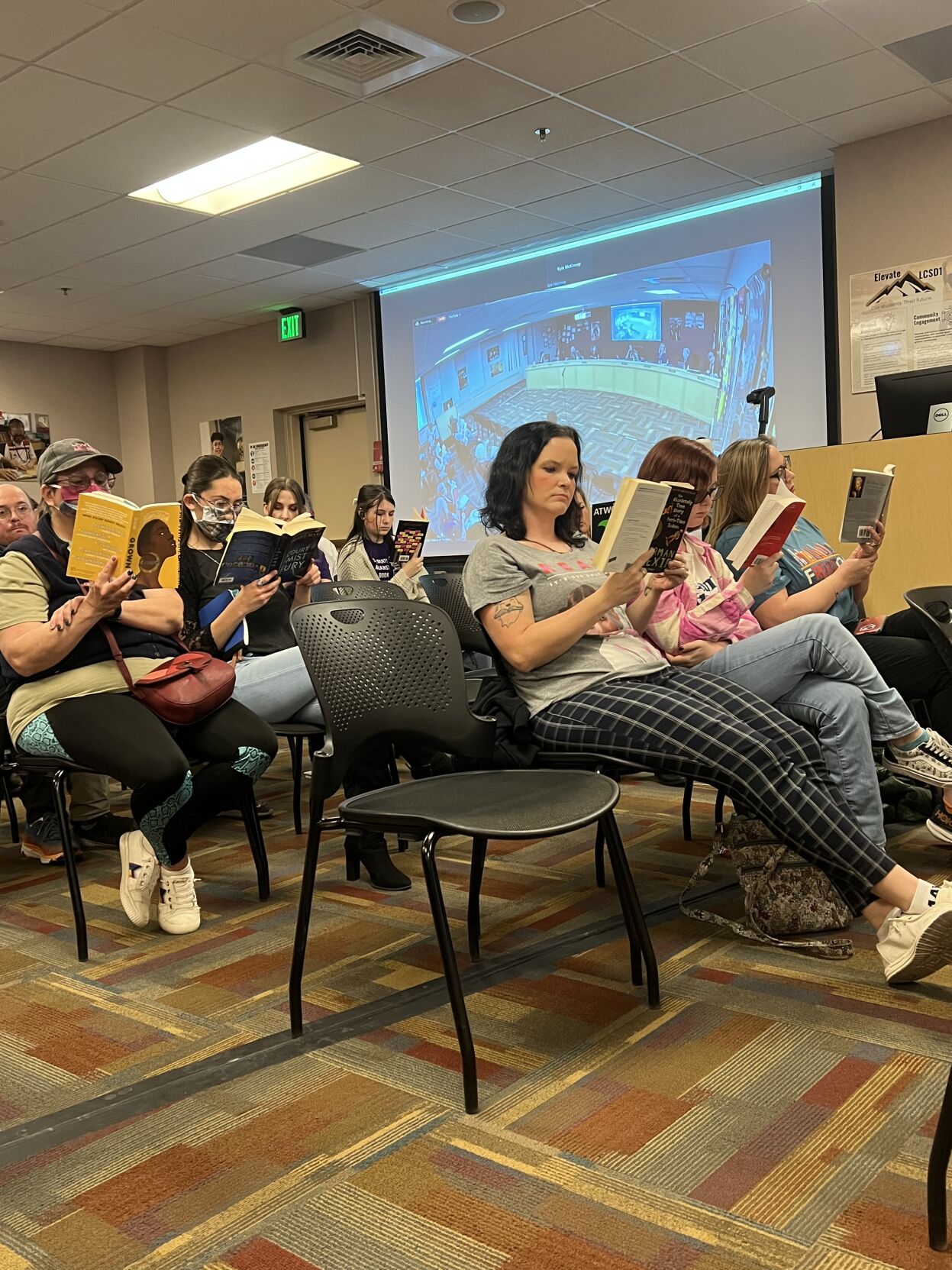 Book policy critics hold silent protest at Monday's LCSD1 Board of ...