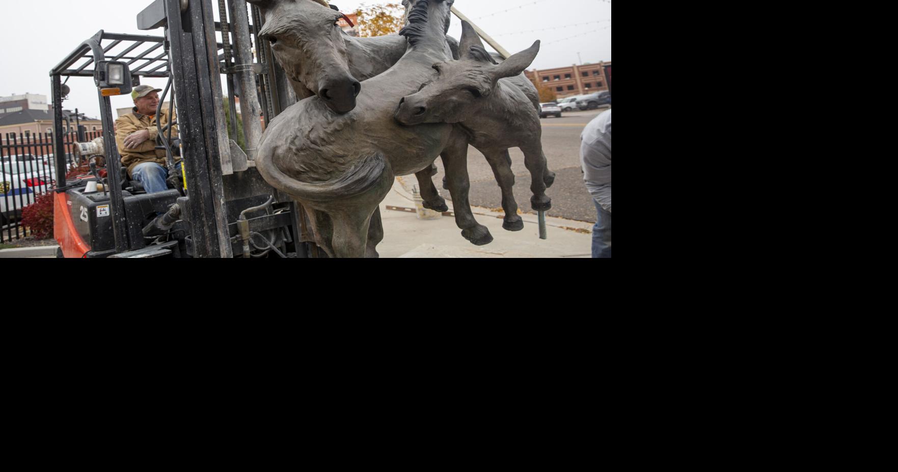 Bronze statue installation, "Swat Team" | Gallery | wyomingnews.com