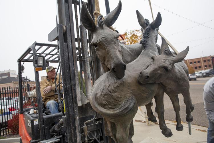 Bronze statue installation, "Swat Team" | Gallery | wyomingnews.com