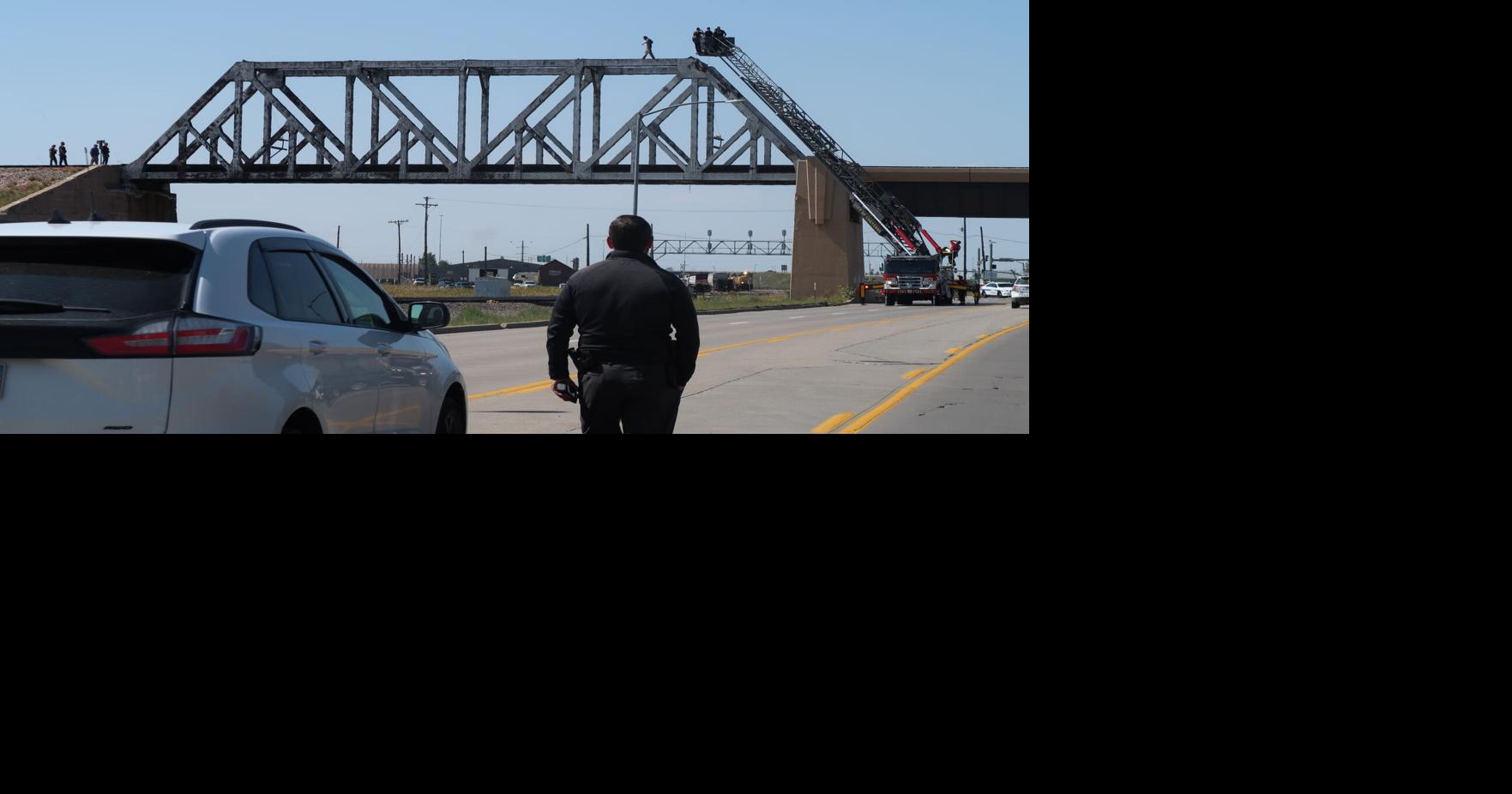 Cheyenne man climbs down from bridge after five hours of negotiations ...