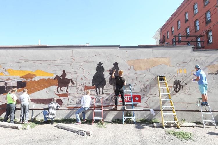 Community pitches in for first paint-by-numbers mural in downtown ...