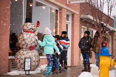 Smore's, snowmen, and strolling: A snowman spectacle in Downtown Rock ...