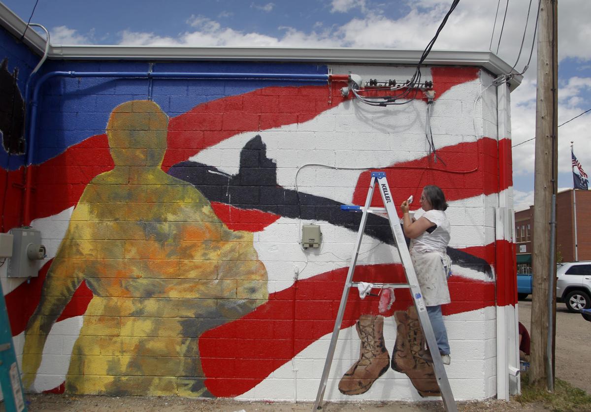 Two Cheyenne artists create downtown mural to honor military | Local ...