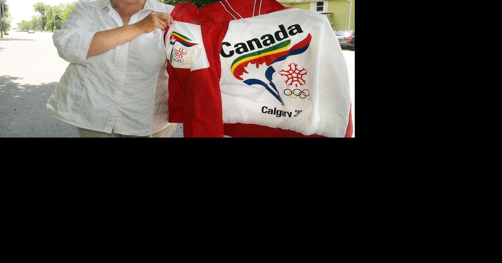 Sharon resident Jane Doran carries Olympic, now Pan Am torch
