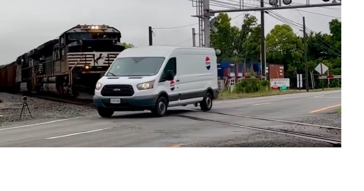 Train enthusiast captures dramatic near-miss at railroad crossing near ...