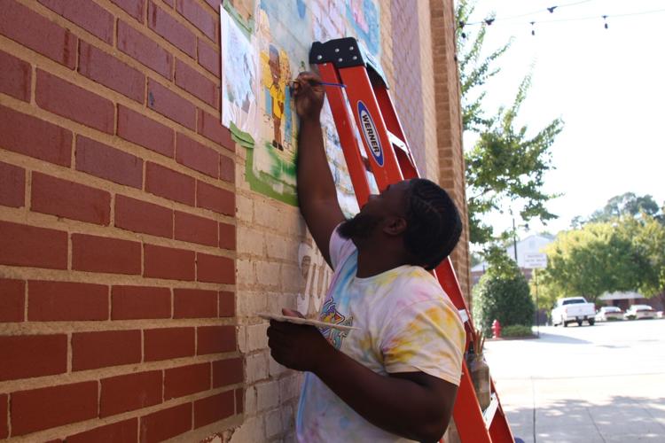 Artist begins work on mural in downtown Halifax alleyway | Town of ...